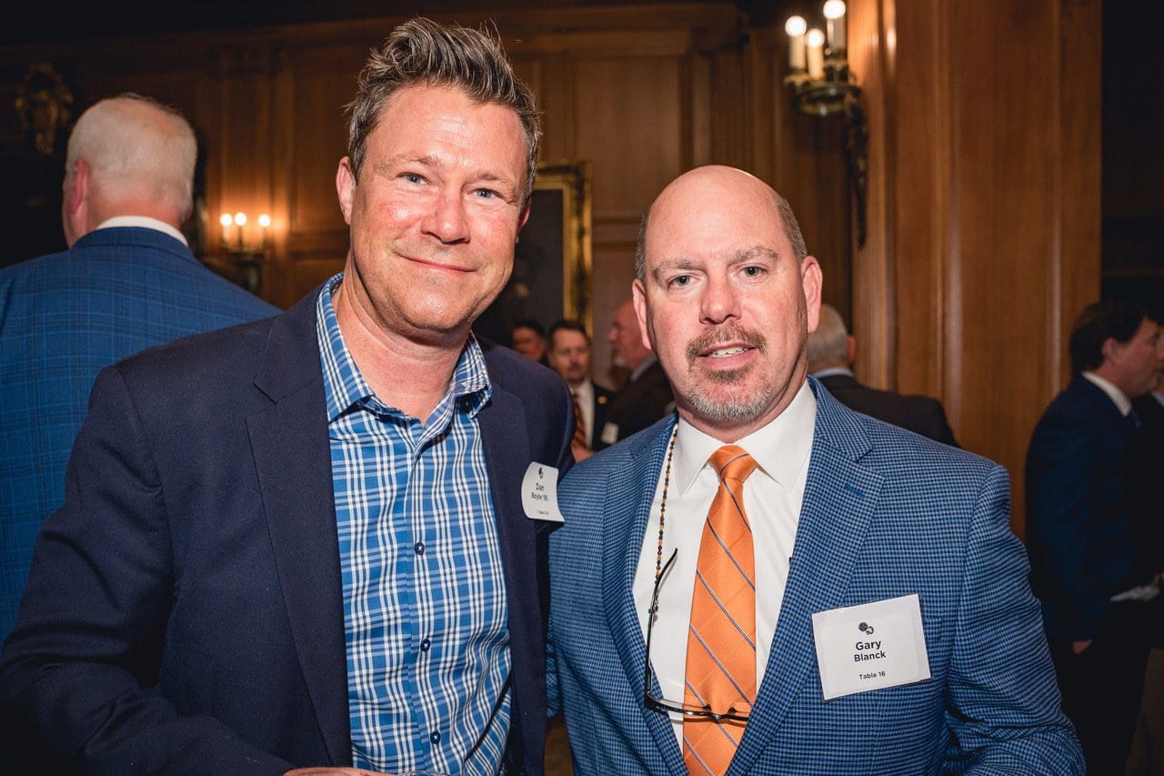 Mike Dubay ’89 and Mark Carroll ’88 with President Tom Reidy